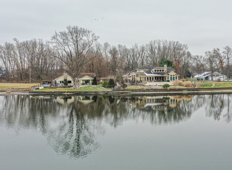 Houses at the Pond with the Weathered Trees Stock Photo - Image of pond ...
