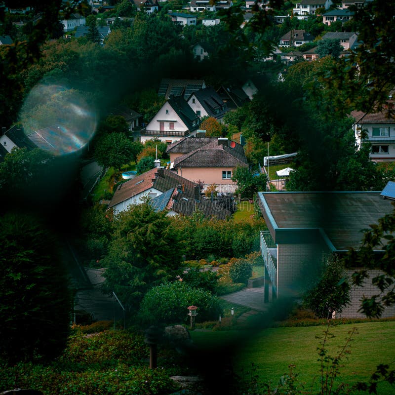 Houses through a Ring Photographer Stock Photo - Image of backyard ...