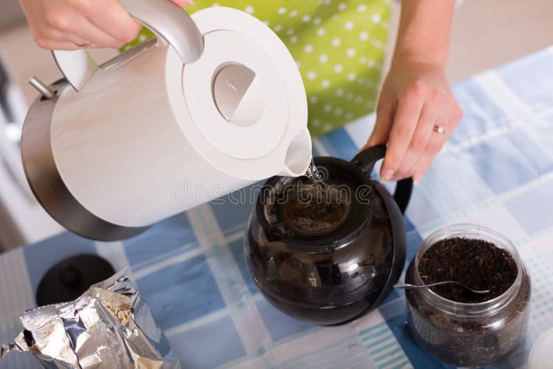 Housewife Making Tea in Domestic Interior Stock Photo - Image of ...