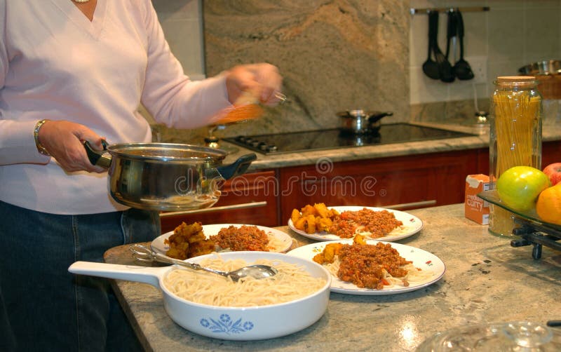 Housewife serving food stock image. Image of stove, meal - 9475953
