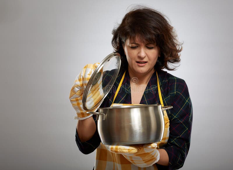 Housewife with a Shock Expression Looking in the Pot Stock Photo ...