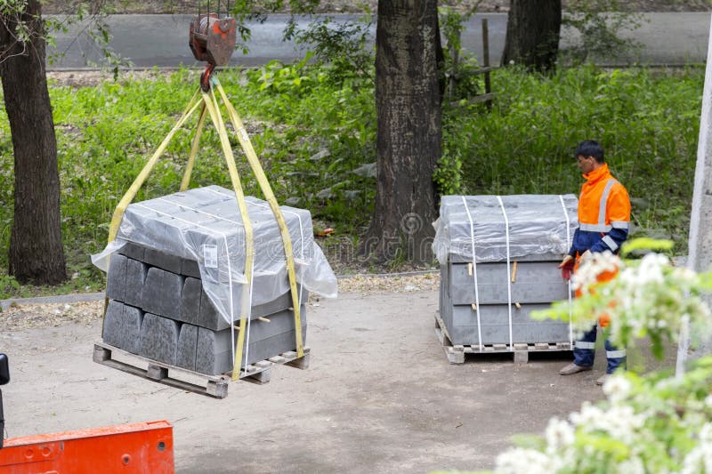 Housing and Communal Services Workers Perform Work on Unloading Heavy ...