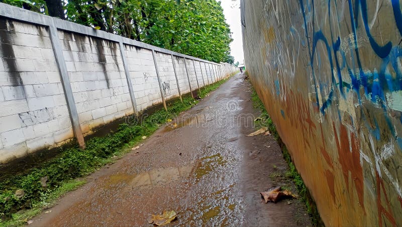 A Housing Complex Road Has Walls on the Left and Right Sides. Stock ...