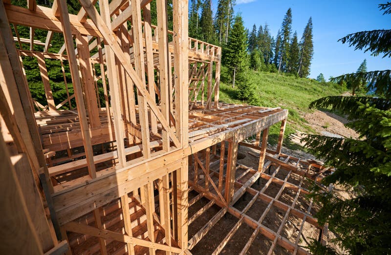 Wooden Frame House Under Construction Near Forest. Stock Image - Image ...