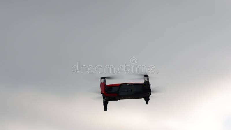 Hovering Drone Flying Upward on a Cloudy Sky Backdrop. Copter Flying ...