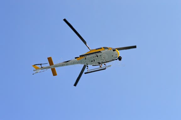 Hovering Helicopter stock image. Image of feet, industry - 45244301