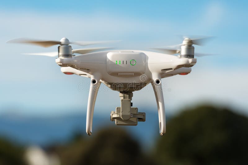 Hovering white drone stock image. Image of controlled - 100511509