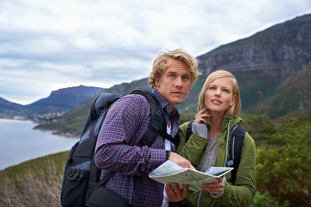 How Do we Get To the Very Top. Two Backpackers with a Map Exploring ...