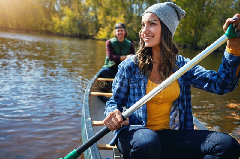 This is How they Do Weekends. a Young Couple Going for a Canoe Ride on ...