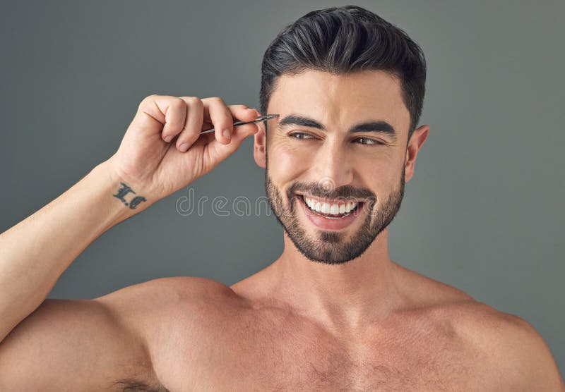 How Does he Get His Brows so Perfect. a Handsome Young Man Tweezing His ...