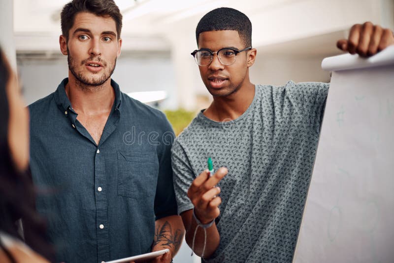 This is How we Go about it. a Handsome Young Businessman Using a Visual ...