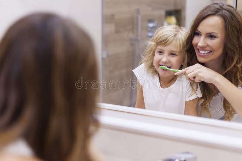 How to brush your teeth stock image. Image of bathroom - 48708405