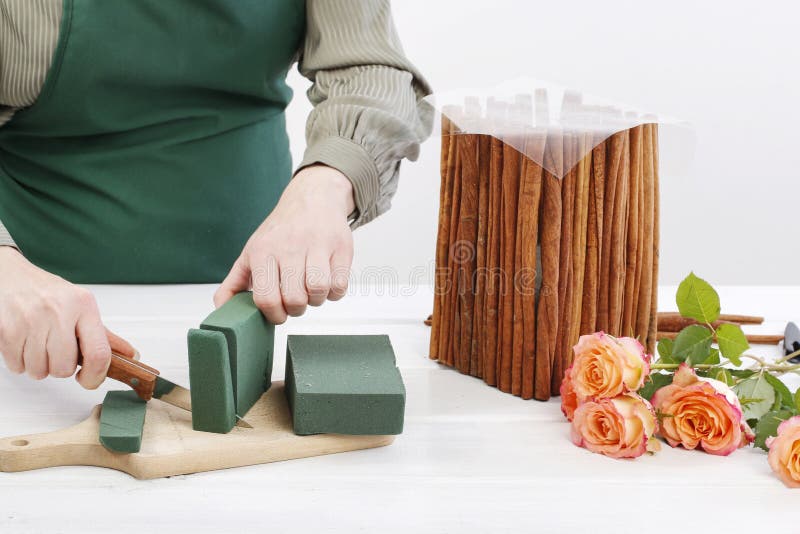 How To Make Floral Arrangement with Roses and Cinnamon Sticks Stock ...