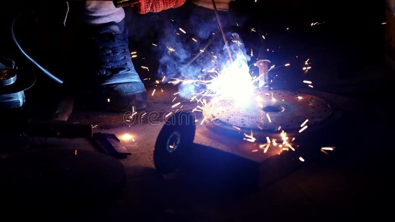 How the Welding Machine Works. a Spark from the Work of a Quarrel Stock ...