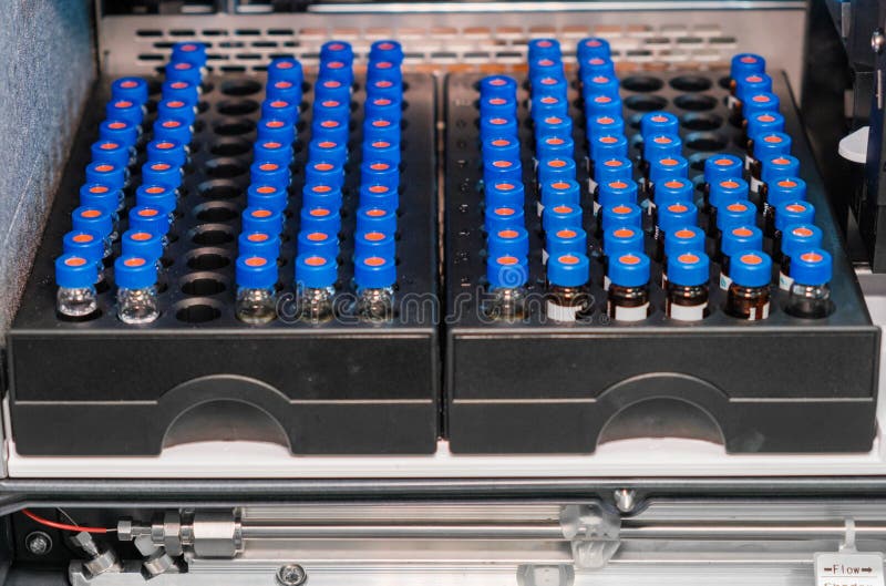 Glass Vials With Blue Caps Are In The Rack Of HPLC System With ...