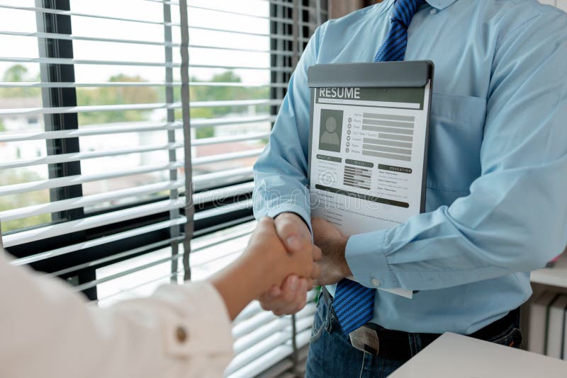 The HR Manager Shakes Hands with a New Employee after he Has ...