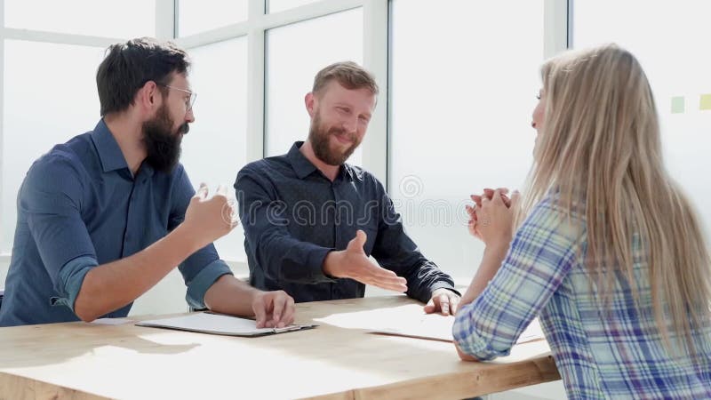 HR Managers Congratulating a Young Woman on a Successful Interview ...