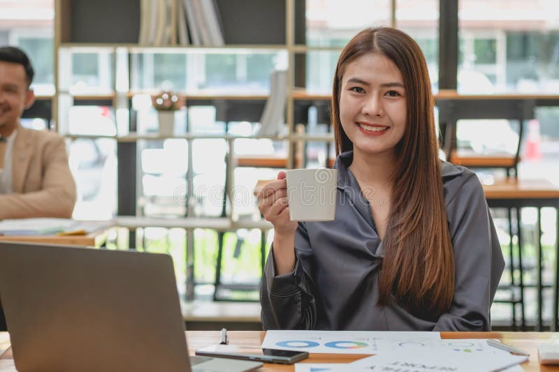 HR Workers Sit Back and Relax with Coffee on Their Desks with Their ...