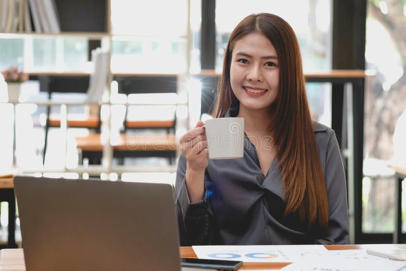 HR Workers Sit Back and Relax with Coffee on Their Desks with Their ...