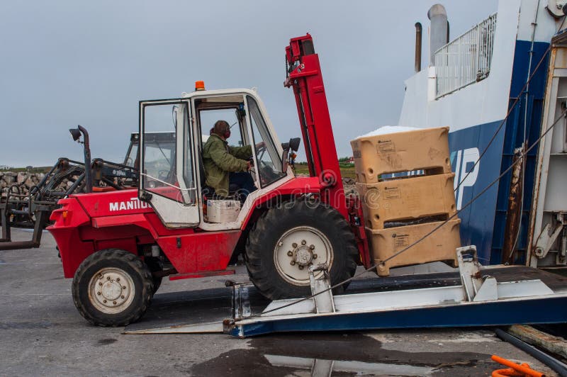 Worker Using a Forklift To Move Fish on Board a Ferry Editorial Stock ...