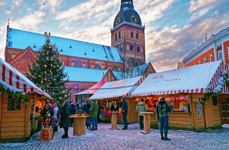 Riga, Latvia - December 28, 2014: Christmas Market at Dome Square in ... Riga, Latvia - December 28, 2014: Christmas Market at Dome Square in ...