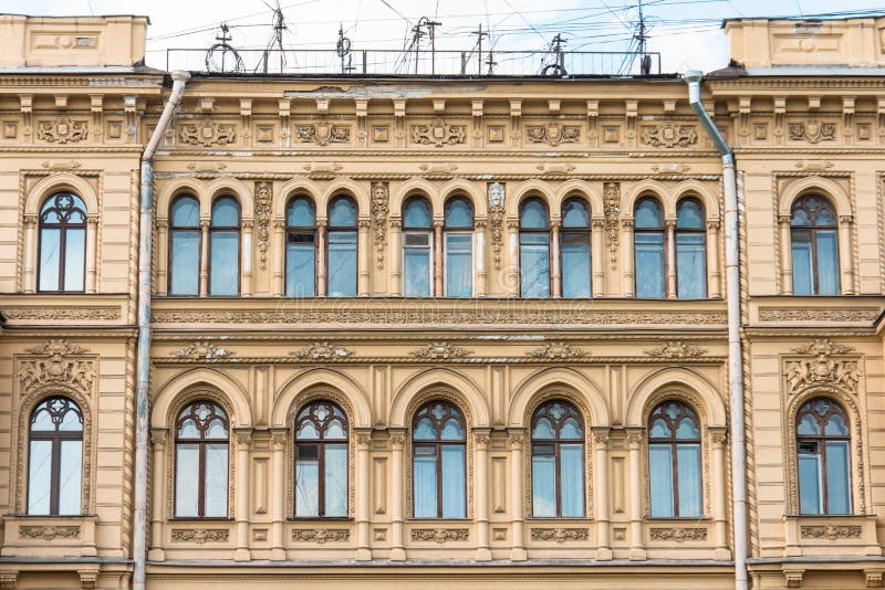 HThe Facade of the Historic Building Yellow-orange Building with Window ...