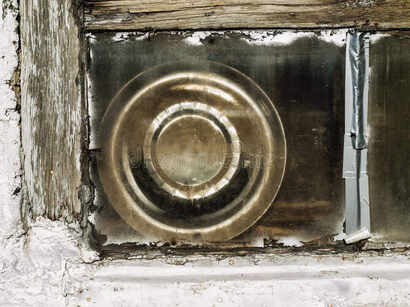Hubcap in a dirty window stock image. Image of tire, metal - 45695705