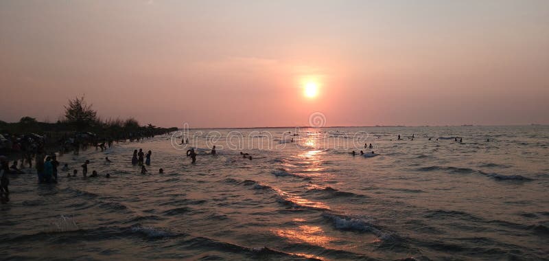 The Hue of the Sunset on Tirang Beach, Semarang Stock Photo - Image of ...
