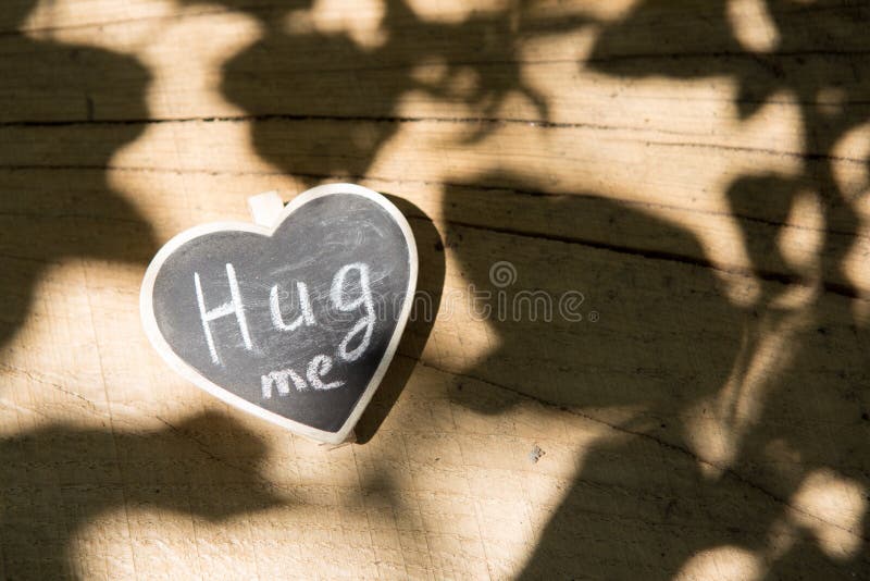 Hug Me Hand Drawing Phrase on a Heart, Share a Hug Day Concept Stock ...