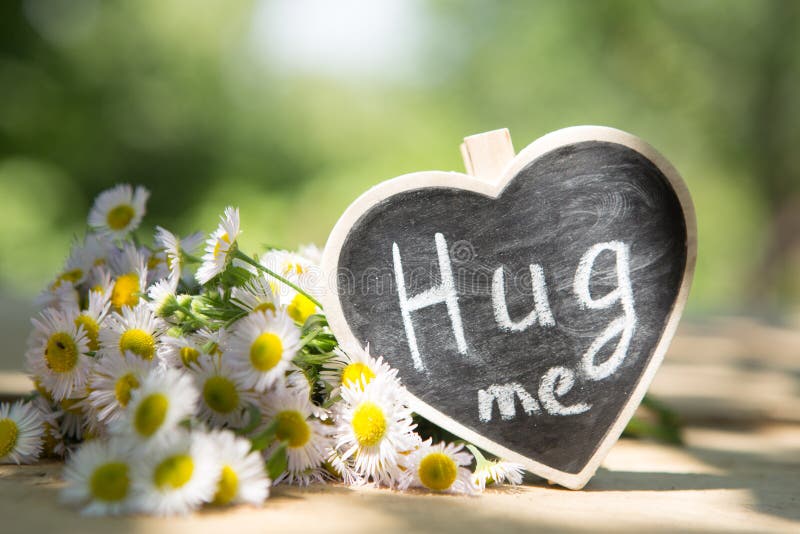 Hug Me Hand Drawing Phrase on a Heart, Sharing a Hug Concept Stock ...