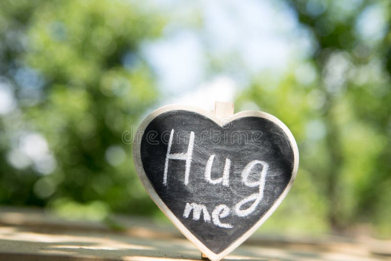 Hug Me Hand Drawing Phrase on a Heart, Sharing a Hug Concept Stock ...
