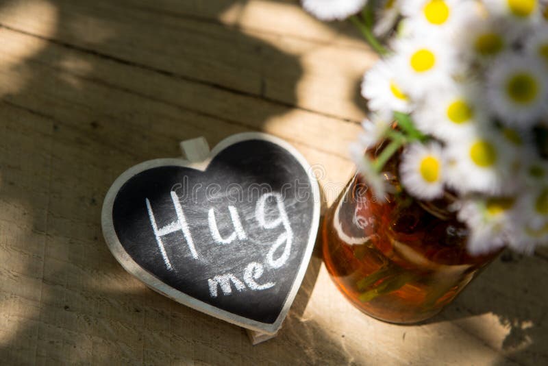 Hug Me Hand Drawing Phrase on a Heart, Sharing a Hug Concept Stock ...