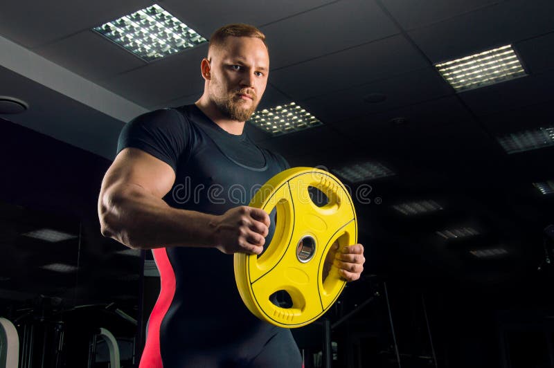 Huge Athlete Holds a Disc for the Bar Stock Image - Image of athlete ...