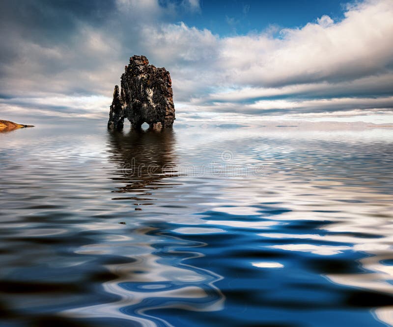Huge Basalt Stack Hvitserkur Reflected in the Calm Waters of Atlantic ...