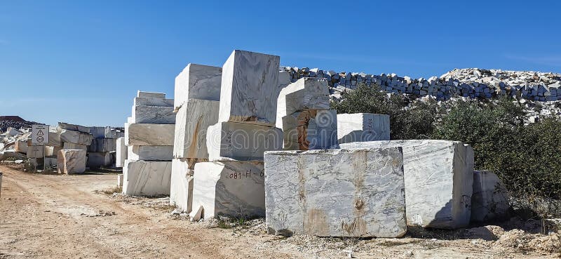Huge Blocks of Stone in an Operating Quarry Stock Photo - Image of pond ...