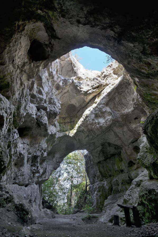 Huge Cave Entrance from Inside Stock Image - Image of field, lighting ...