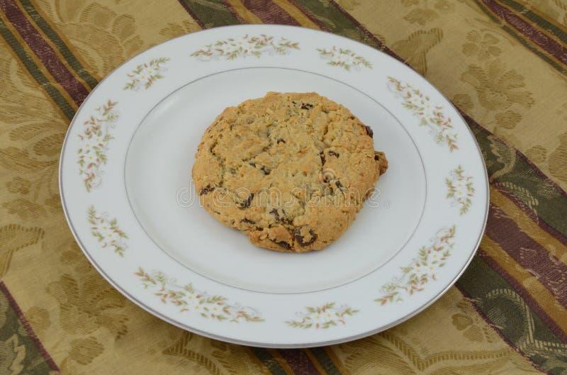 Huge Chocolate Chip Cookie on Plate on Tablecloth Stock Photo - Image ...