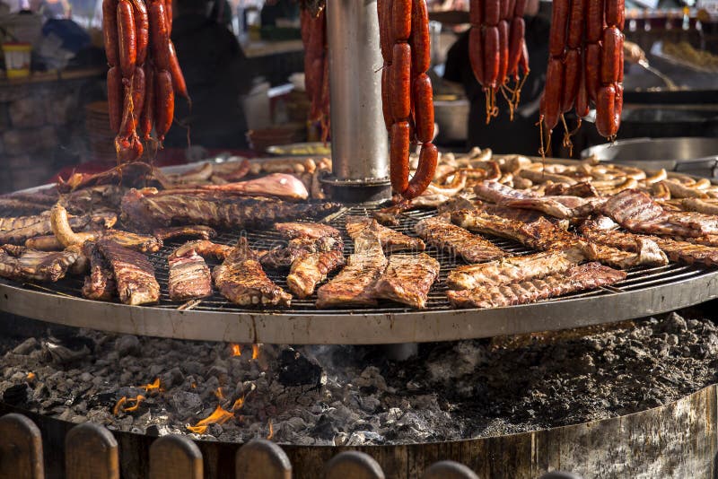 Huge Circular Grill with Assorted Meat on the Embers Stock Image ...