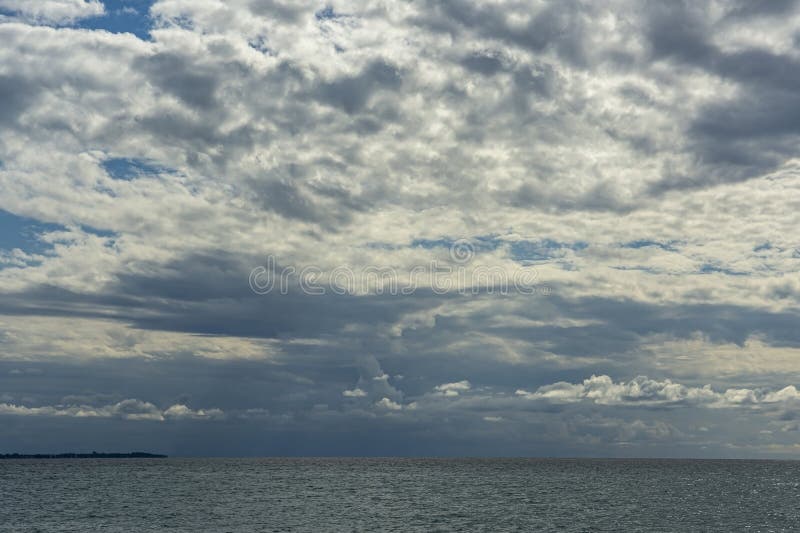 A Huge Cloudy Sky Filled with Thick Cumulus Clouds Creating a Dramatic Spectacle. Midsummer ...