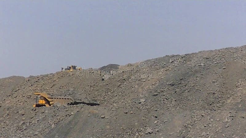 A Huge Dump Truck is Moving Along the Technological Road Stock Video ...