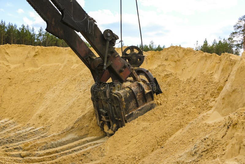 Huge Excavator Bucket Digs Sand in Sand Quarry Mining Stock Photo ...