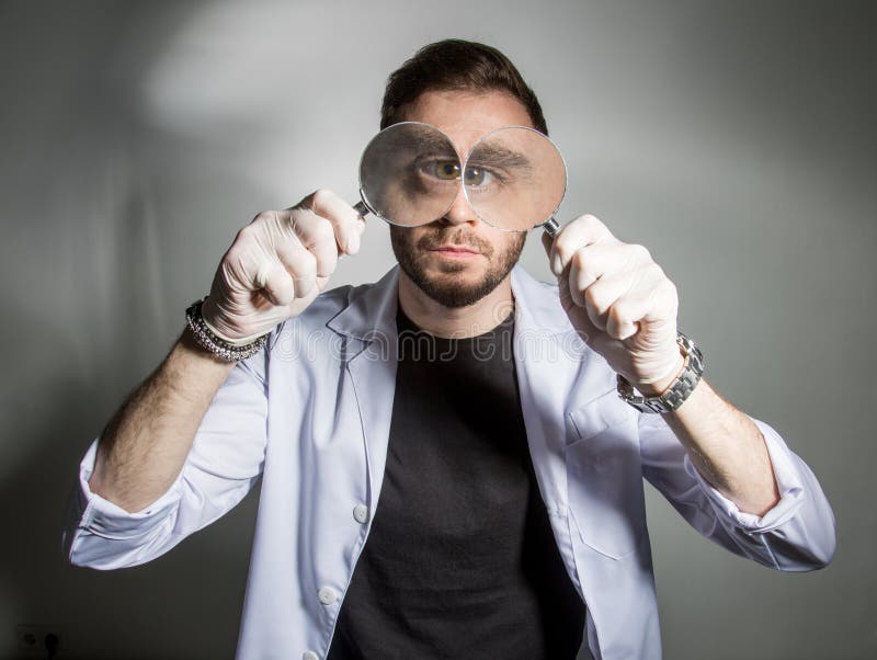 Huge Eyes of a Scientist Using a Magnifying Glass Stock Photo - Image ...