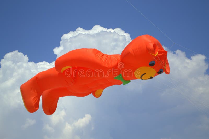 Huge Flying Orange Bear Kite Stock Image - Image of kite, background ...