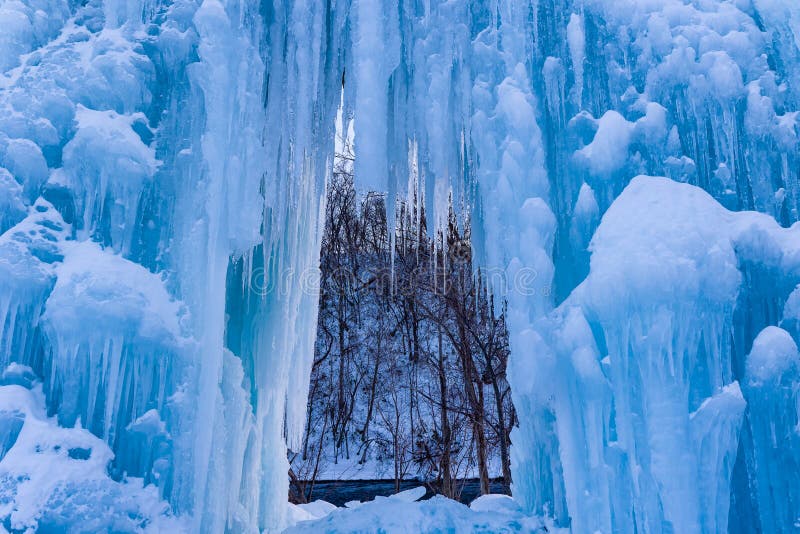 Huge Frozen Icicles on the Shore of a Lake Stock Image - Image of ...