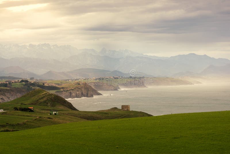 Huge Green Grass Field and a Cliff Landscape Stock Photo - Image of ...