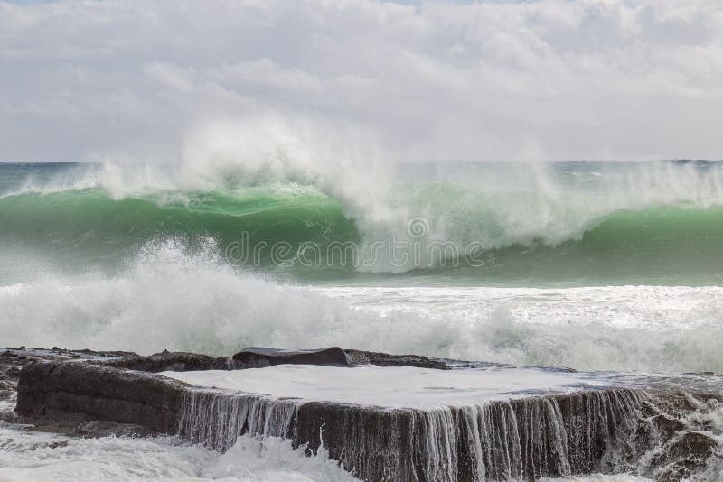 A Huge Green Wave Breaks Dramatically Just Offshore from a Man Made ...