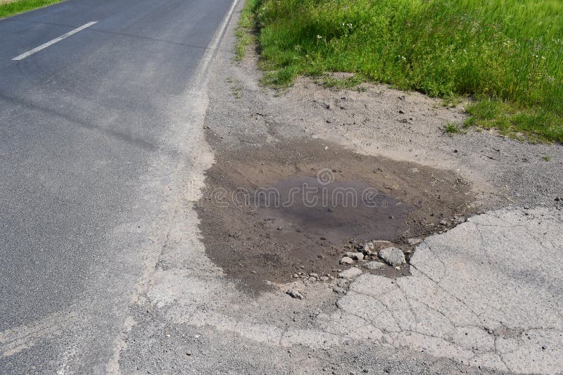 Water filled pothole stock photo. Image of seasonal - 278598556