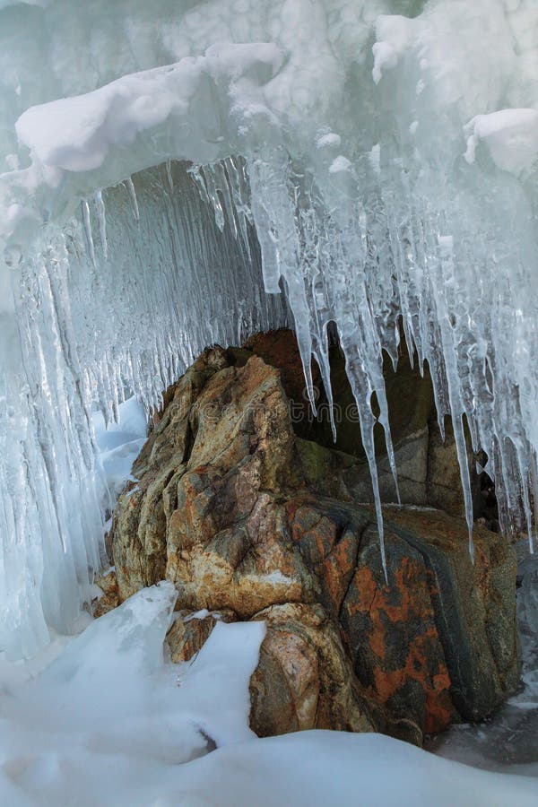 Huge icicles on a cliff. stock image. Image of hummock - 71122609