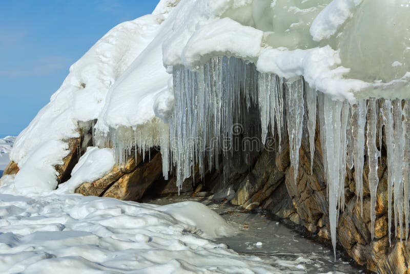 Huge icicles on a cliff. stock photo. Image of glacier - 72755112