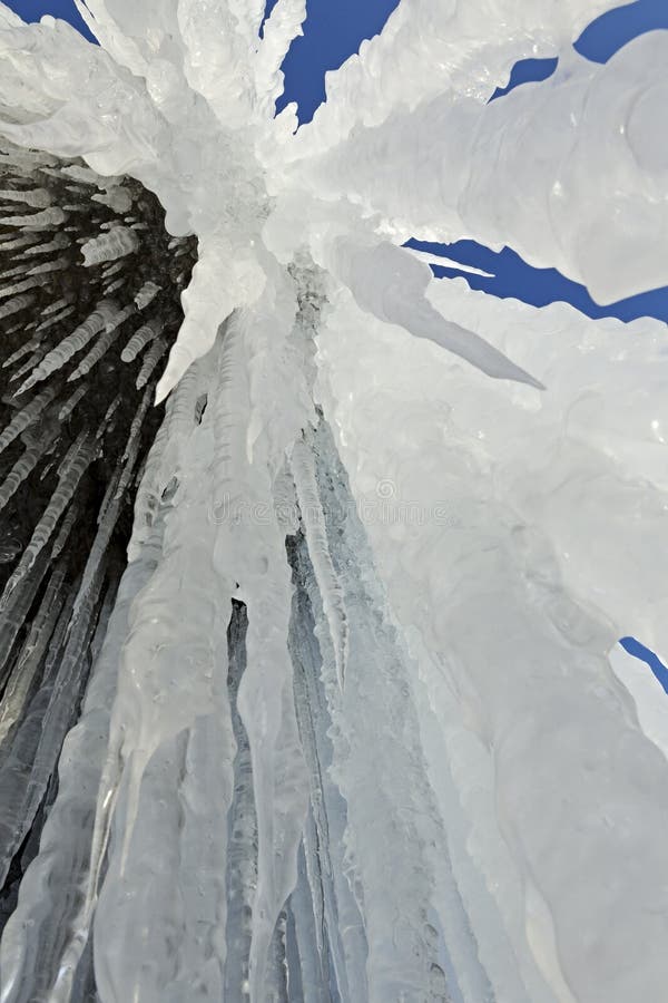 Huge icicles on rocks. stock photo. Image of cheremshan - 68460116